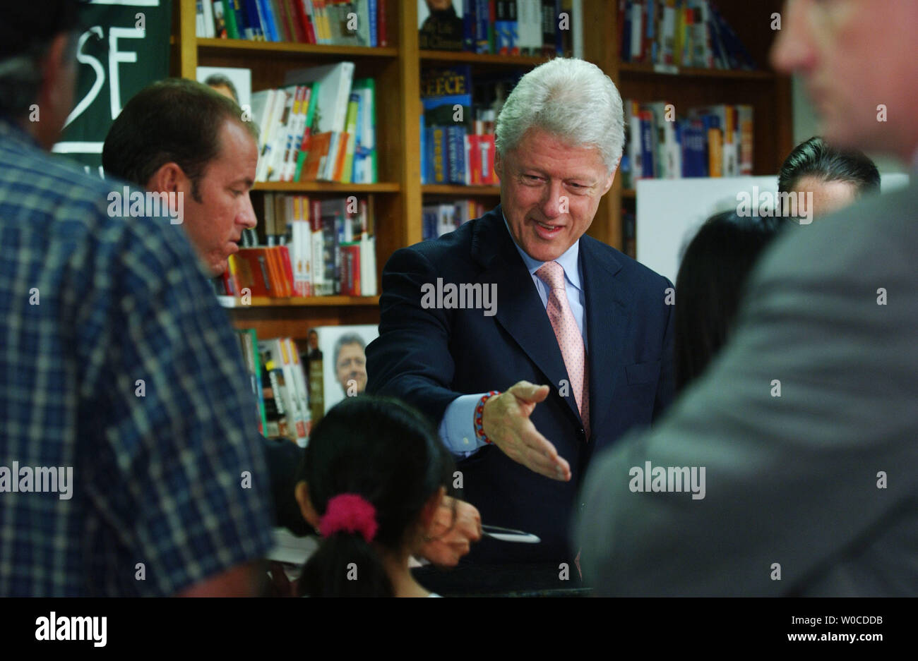 Former President Bill Clinton greets supporters at a book signing at ...