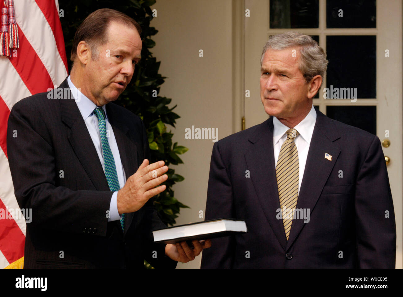 President George W. Bush recieves the 9/11 report from Commissioner ...