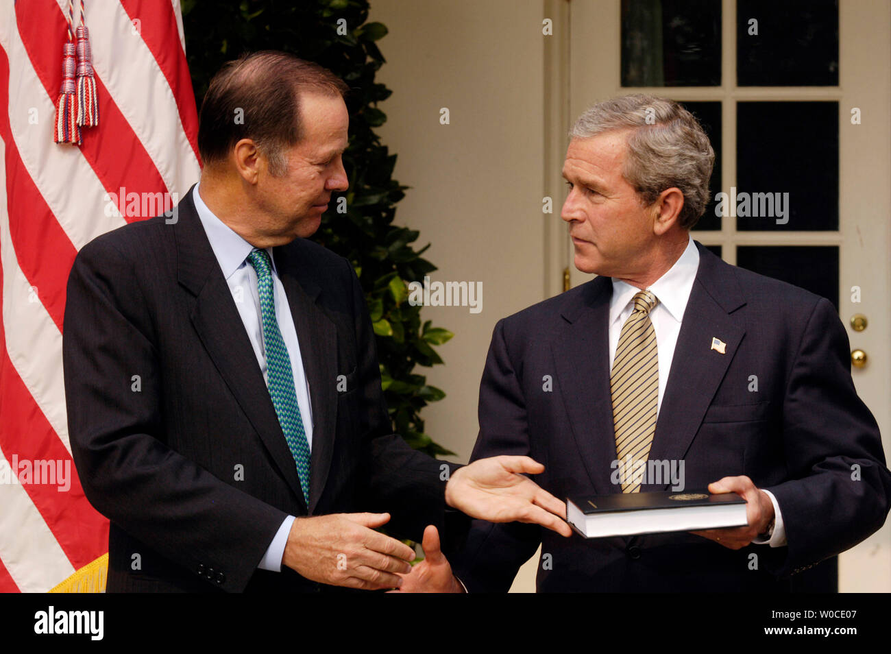 President George W. Bush recieves the 9/11 report from Commissioner ...