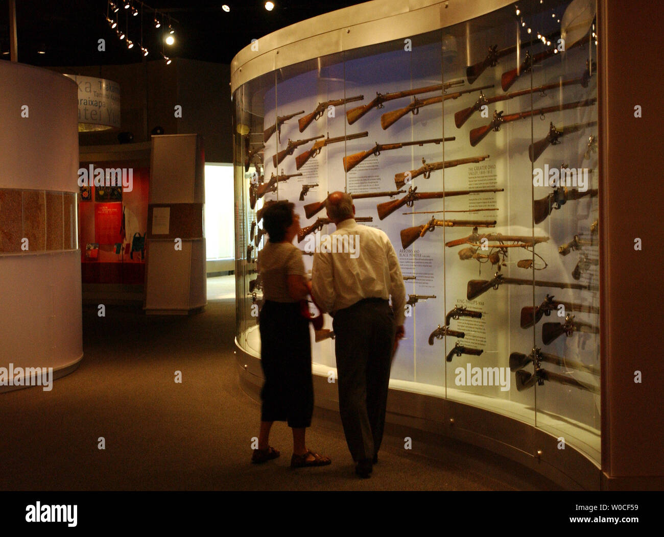 Visitors view some of the artifacts at the Smithsonian's National ...