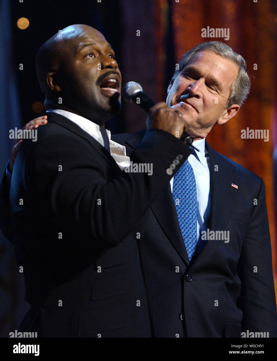 President George W. Bush put his arm around singer Bebe Winans as he ...