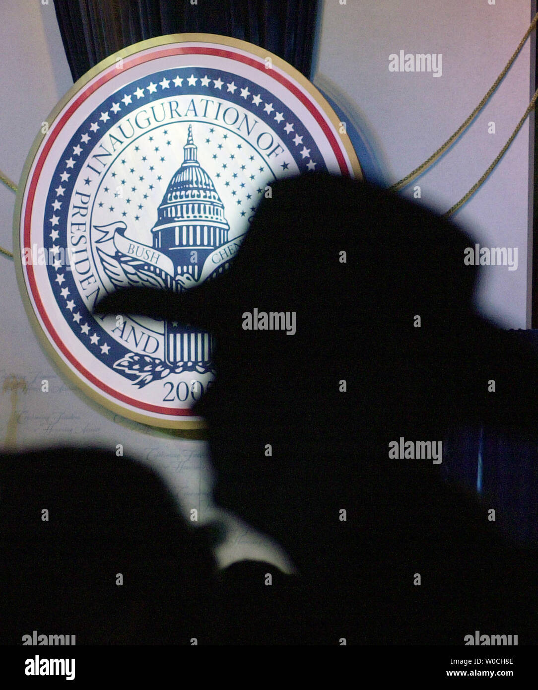 A cowboy hat is silhouetted against the seal of the inauguration at the ...