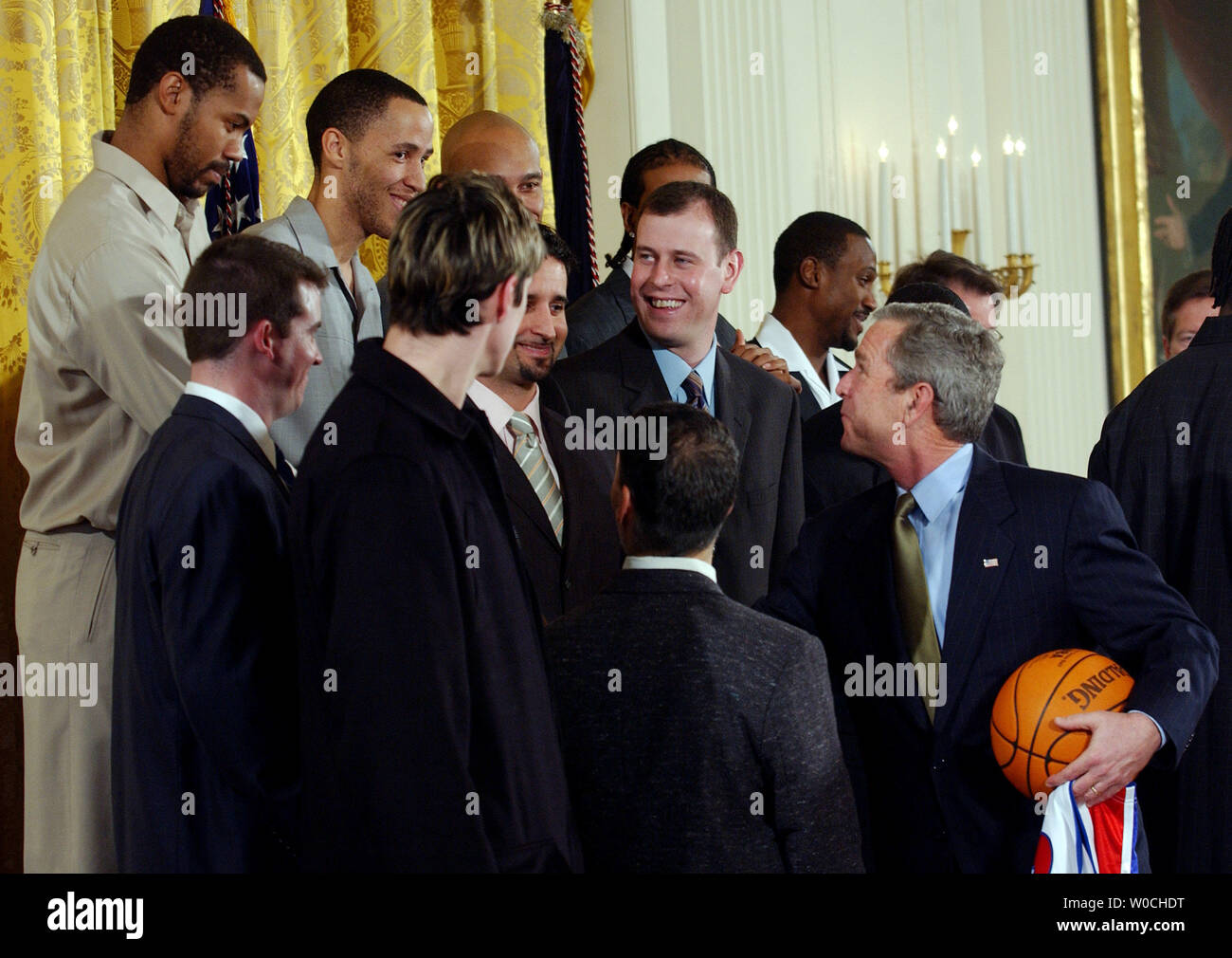 President George W. Bush shakes hands with members of the Detroit ...