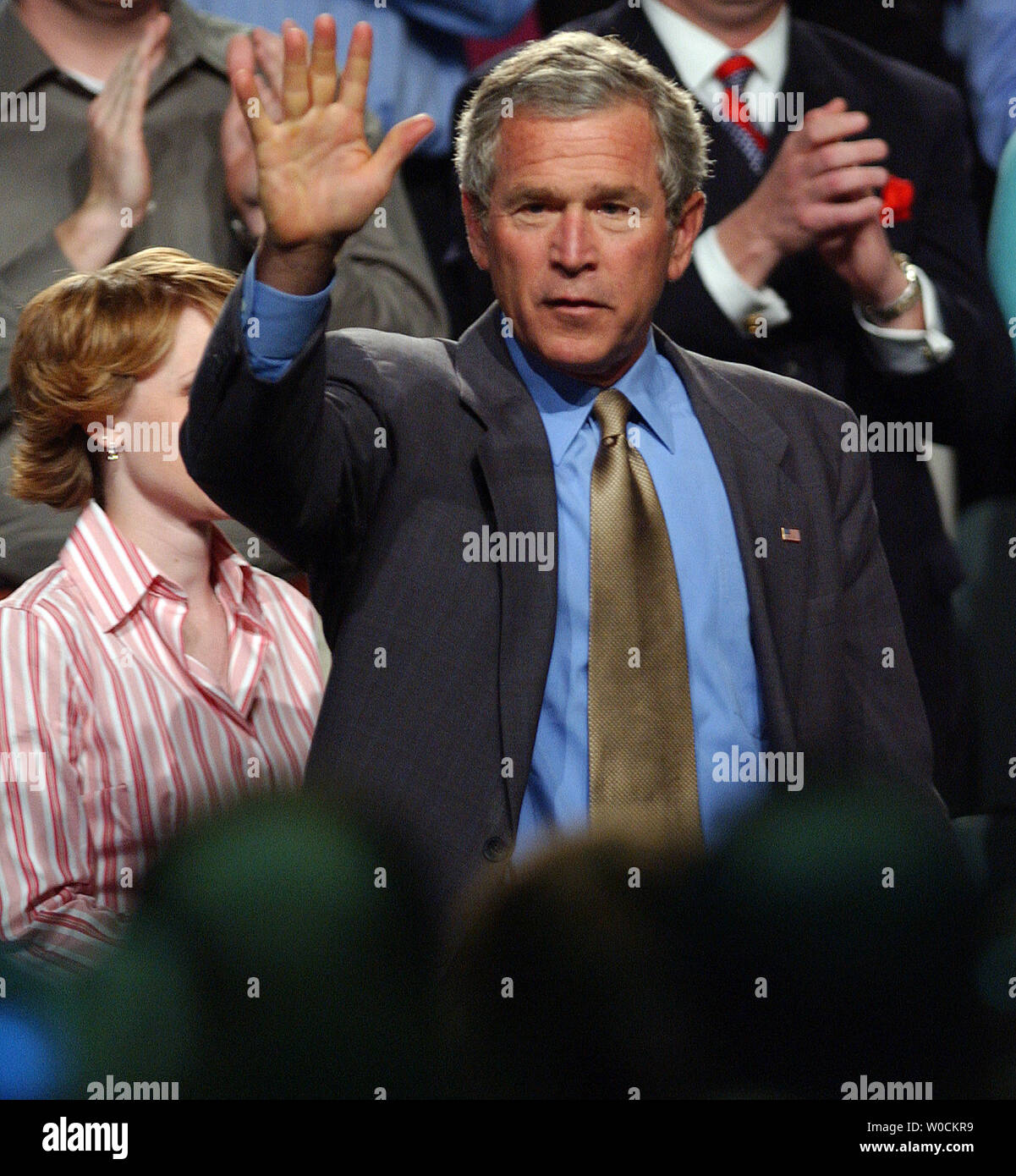 U.S. President George W. Bush waves as he prepares to discuss Social ...
