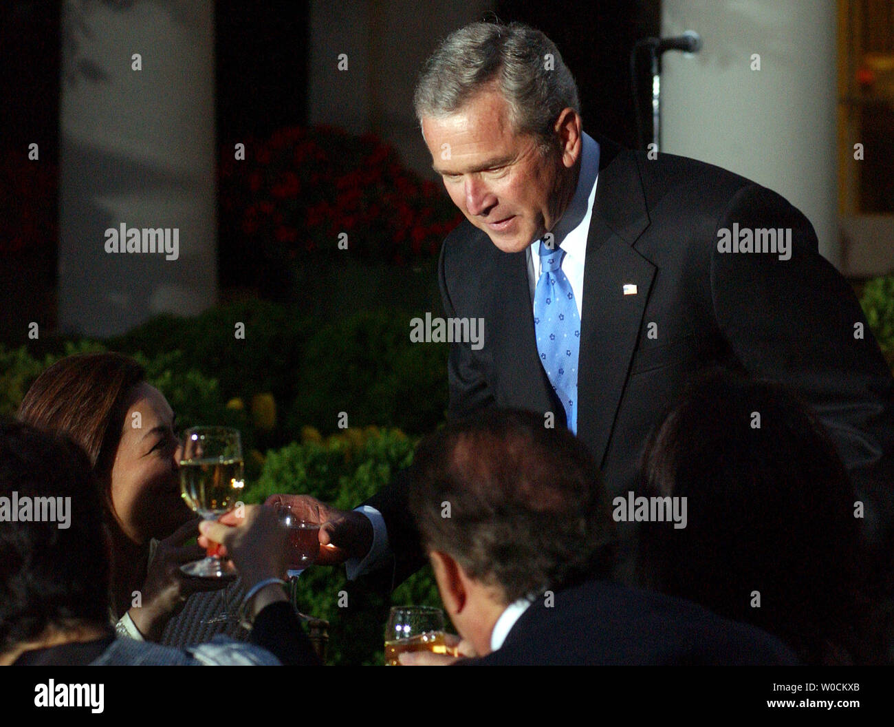 U.S. President George W. Bush toasts with guest after he made remarks ...