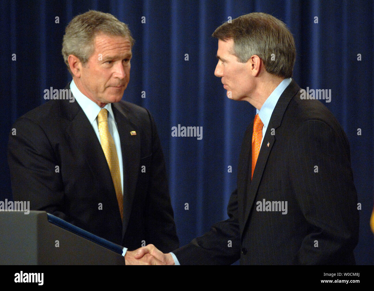 Rob Portman shakes hands with US President George W. Bush after Portman ...
