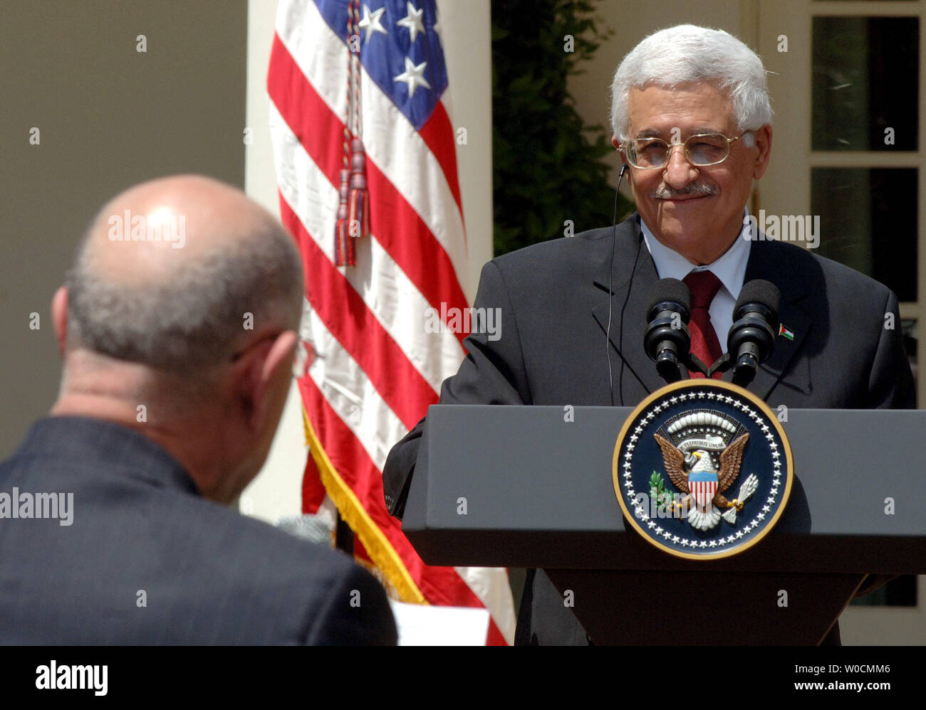 Palestinian President Mahmoud Abbas listens to a question from a ...