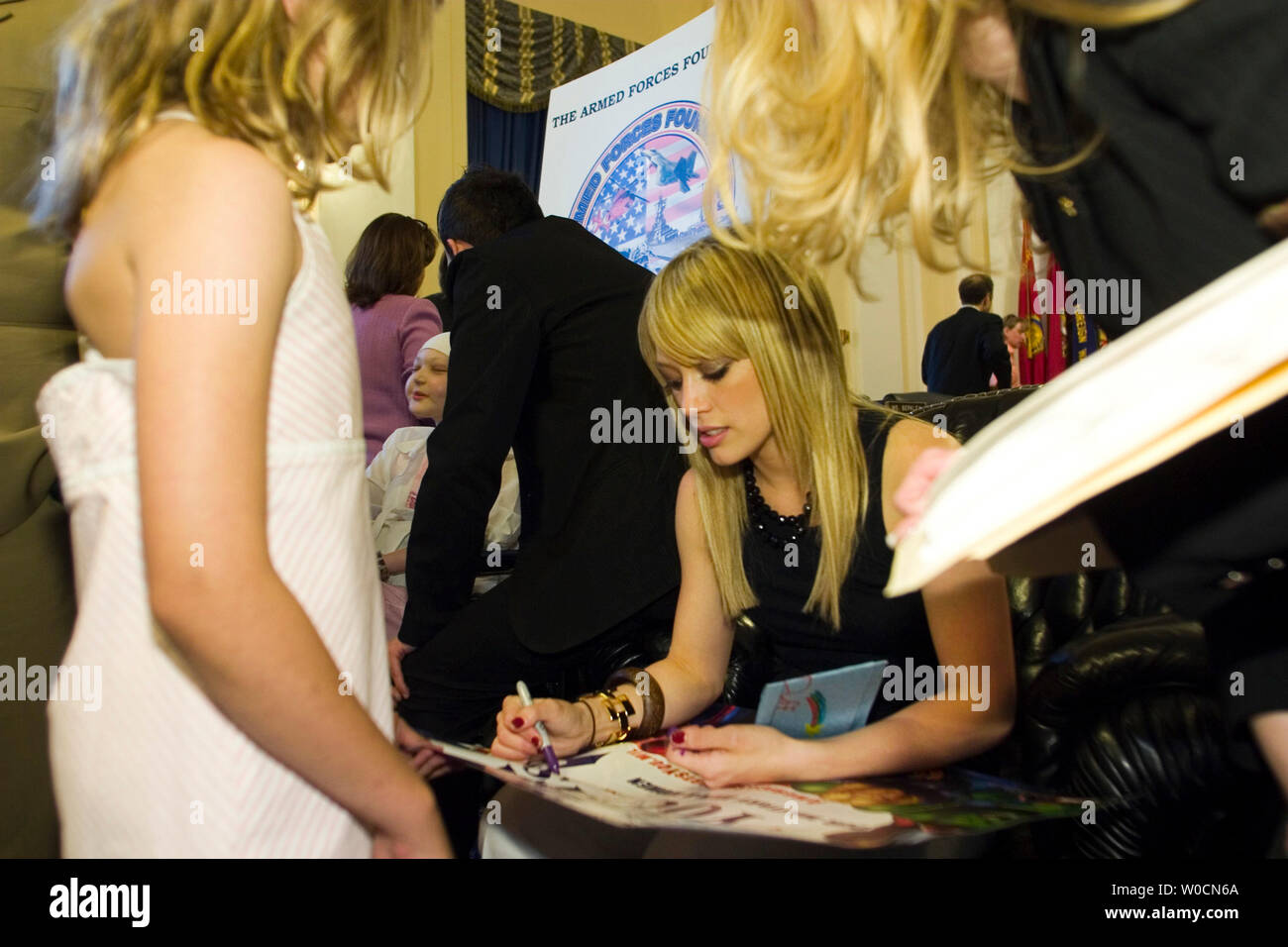 Actress Hilary Duff signs an autograph during a visit to Capitol Hill ...