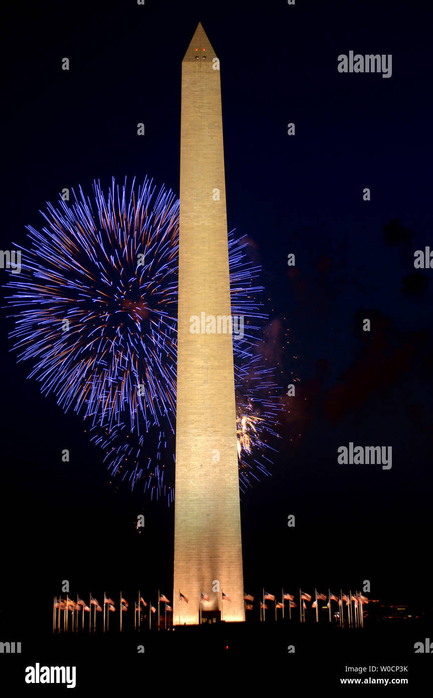 Fireworks explode near the Washington Monument during the 4th of July ...
