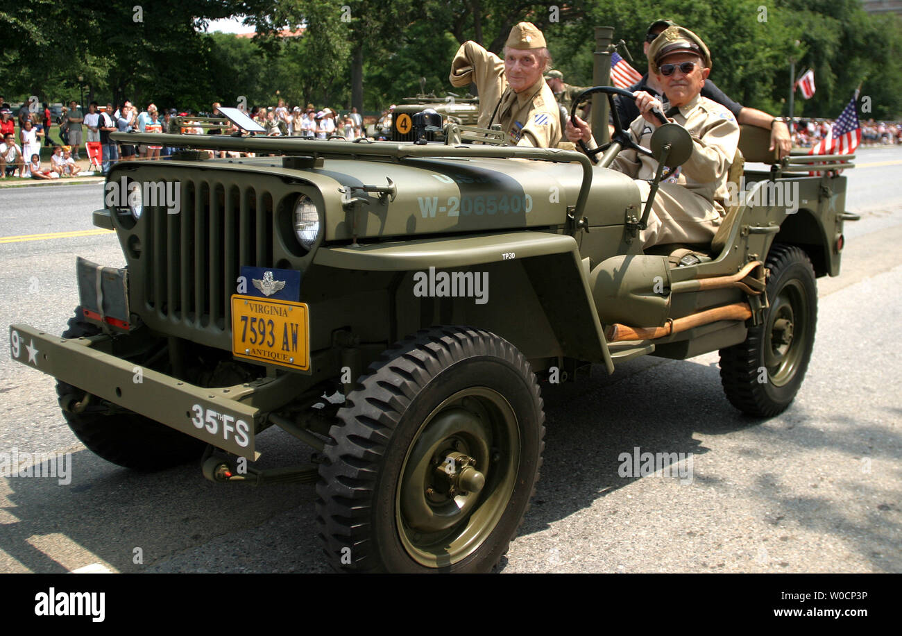 Members of the Washington Area Collectors of Military Vehicles drive a ...