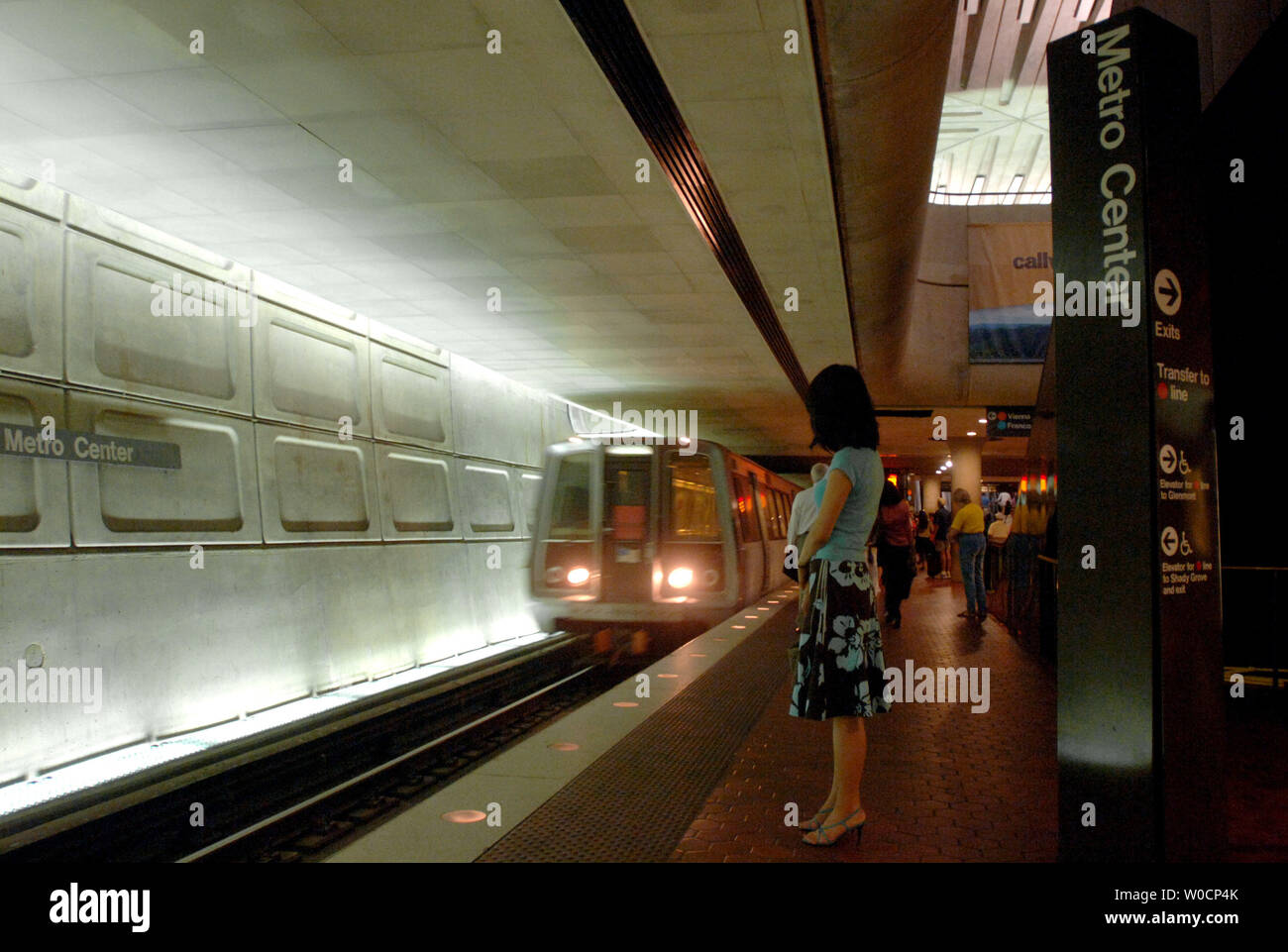 Passengers wait for a train at Washington's Metro Center on July 7 ...
