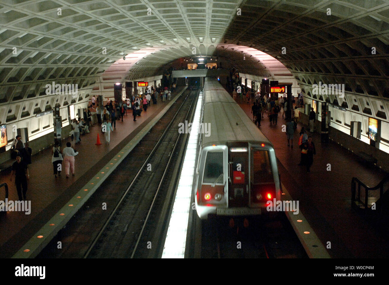 Passengers wait for a train at Washington's Metro Center on July 7 ...