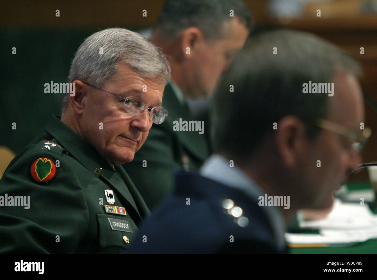 General Bantz Craddock watches as Lt. General Randall Schmidt testifies ...