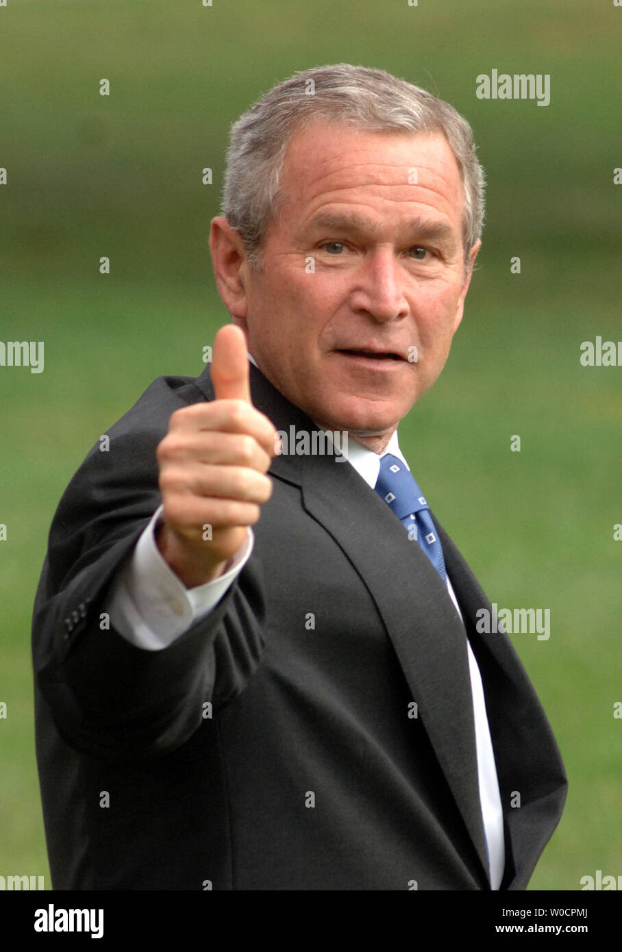 U.S. President George W. Bush gives a "thumbs up" on his way to Marine ...