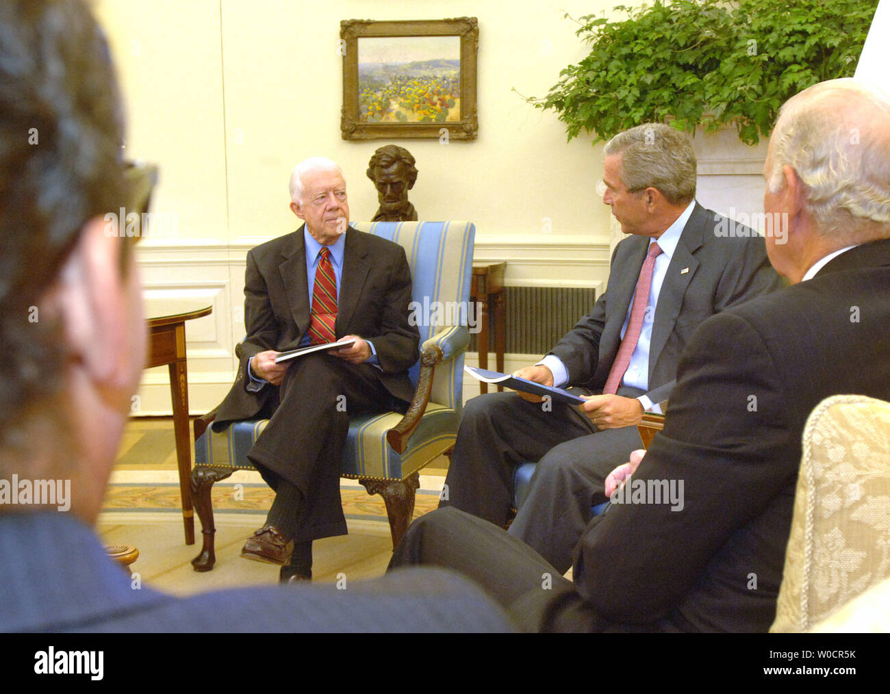 Former President Jimmy Carter, talks with U.S. President George W. Bush ...
