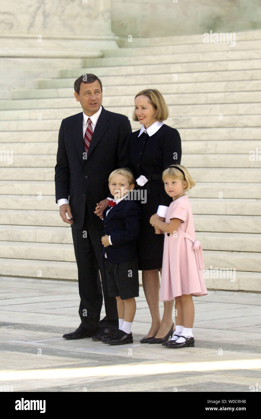 Chief Justice John G. Roberts poses with his family on the front steps ...