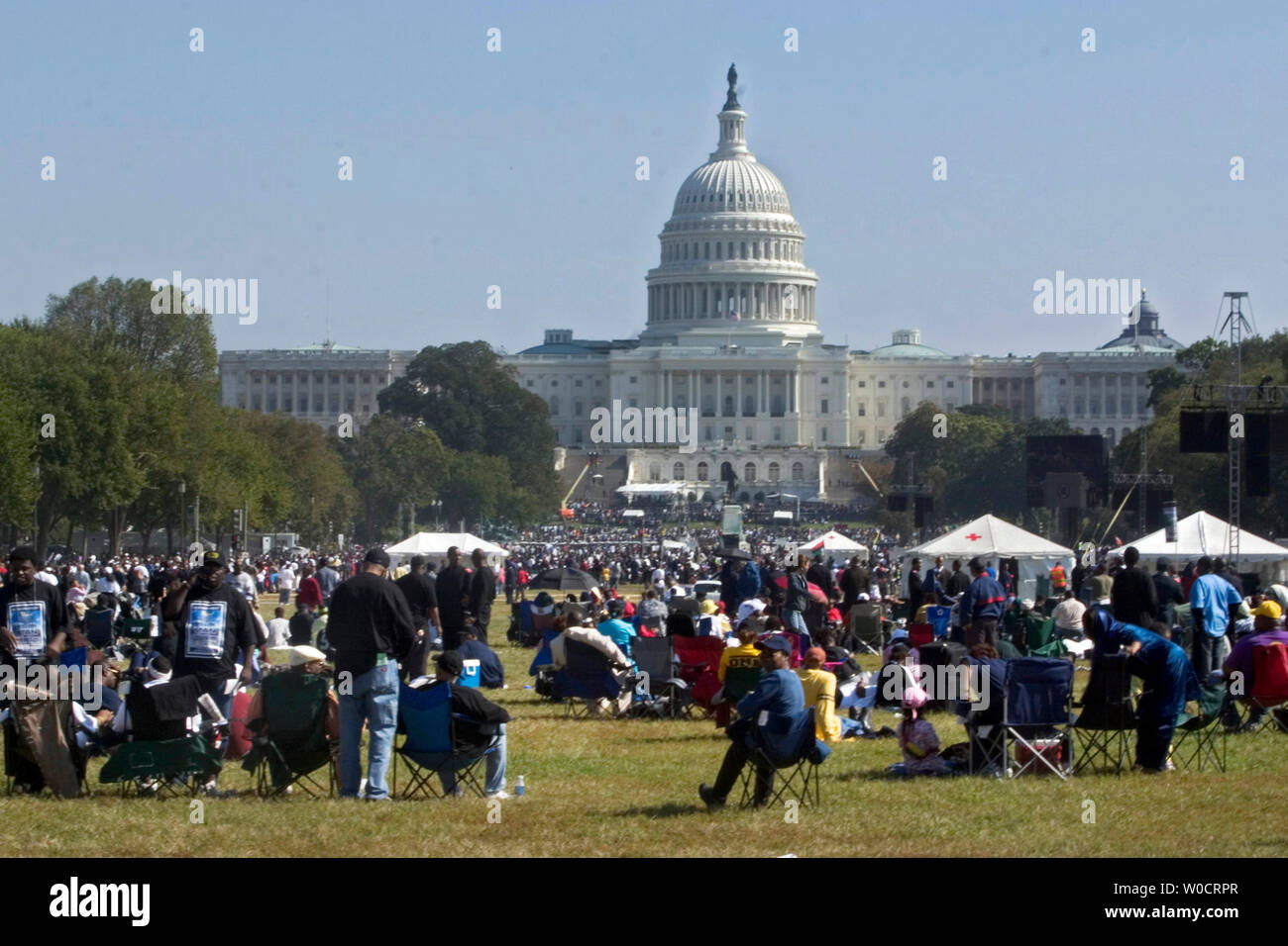 Participants listen to speeches during the Millions More Movement march ...