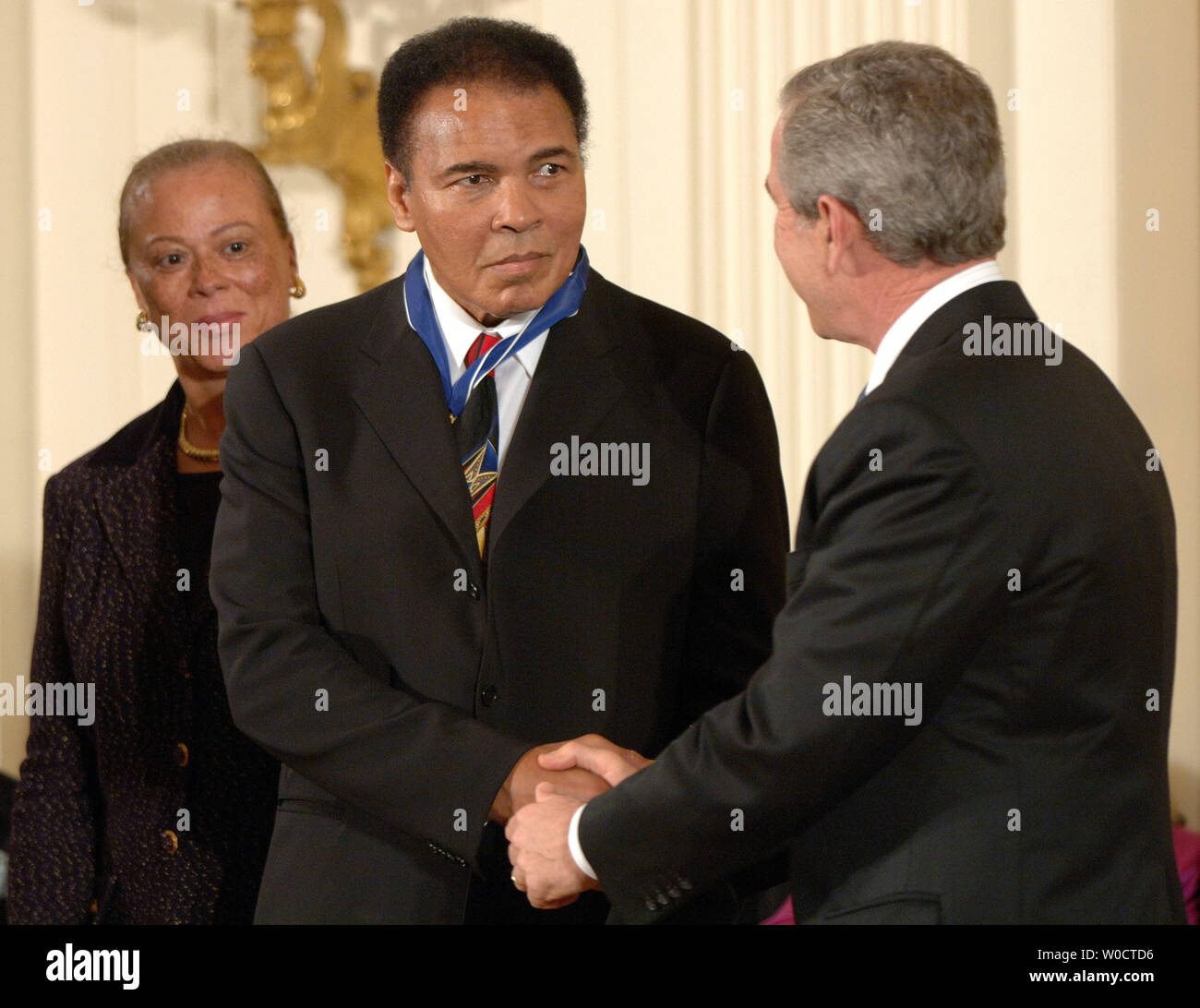 U.S. President George W. Bush shakes hands with boxing legend Muhmmad ...