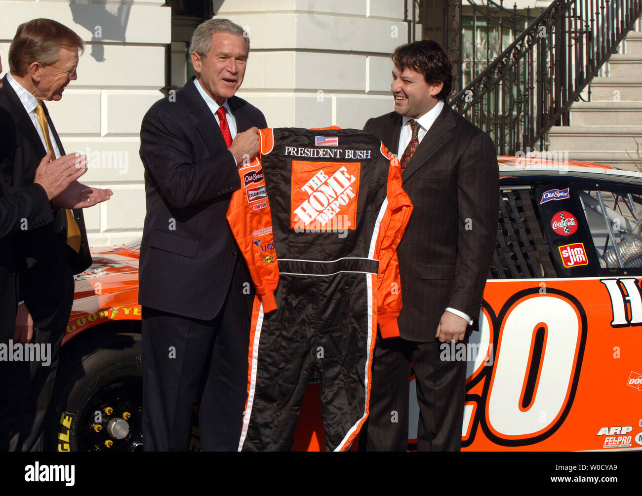 U.S. President George W. Bush receives a drivers suit from 2005 NASCAR ...