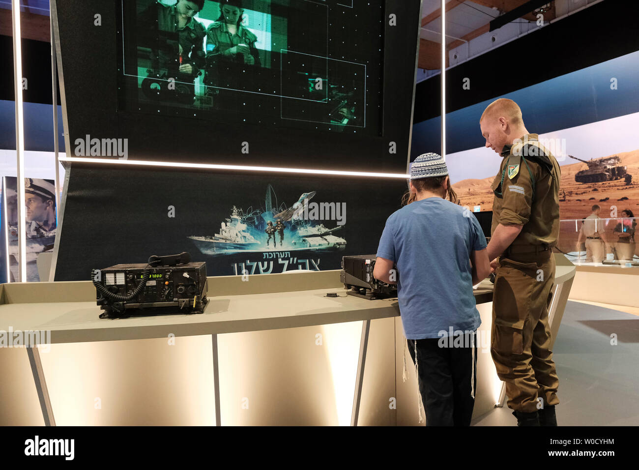 Jerusalem, Israel. 27th June 2019. An Israeli soldier watch young ...