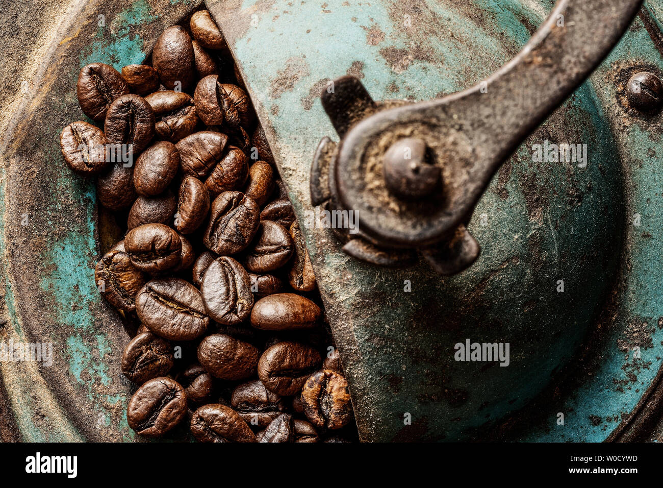 Old blue coffee grinder with coffee beans. Top view, detail Stock Photo ...