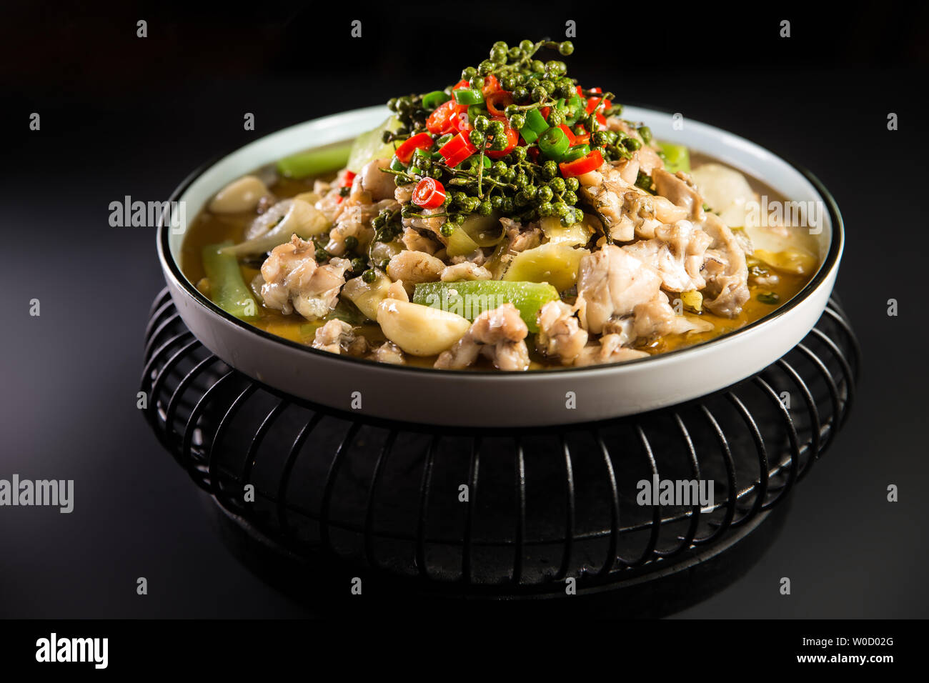 Rattan pepper field chicken Stock Photo - Alamy