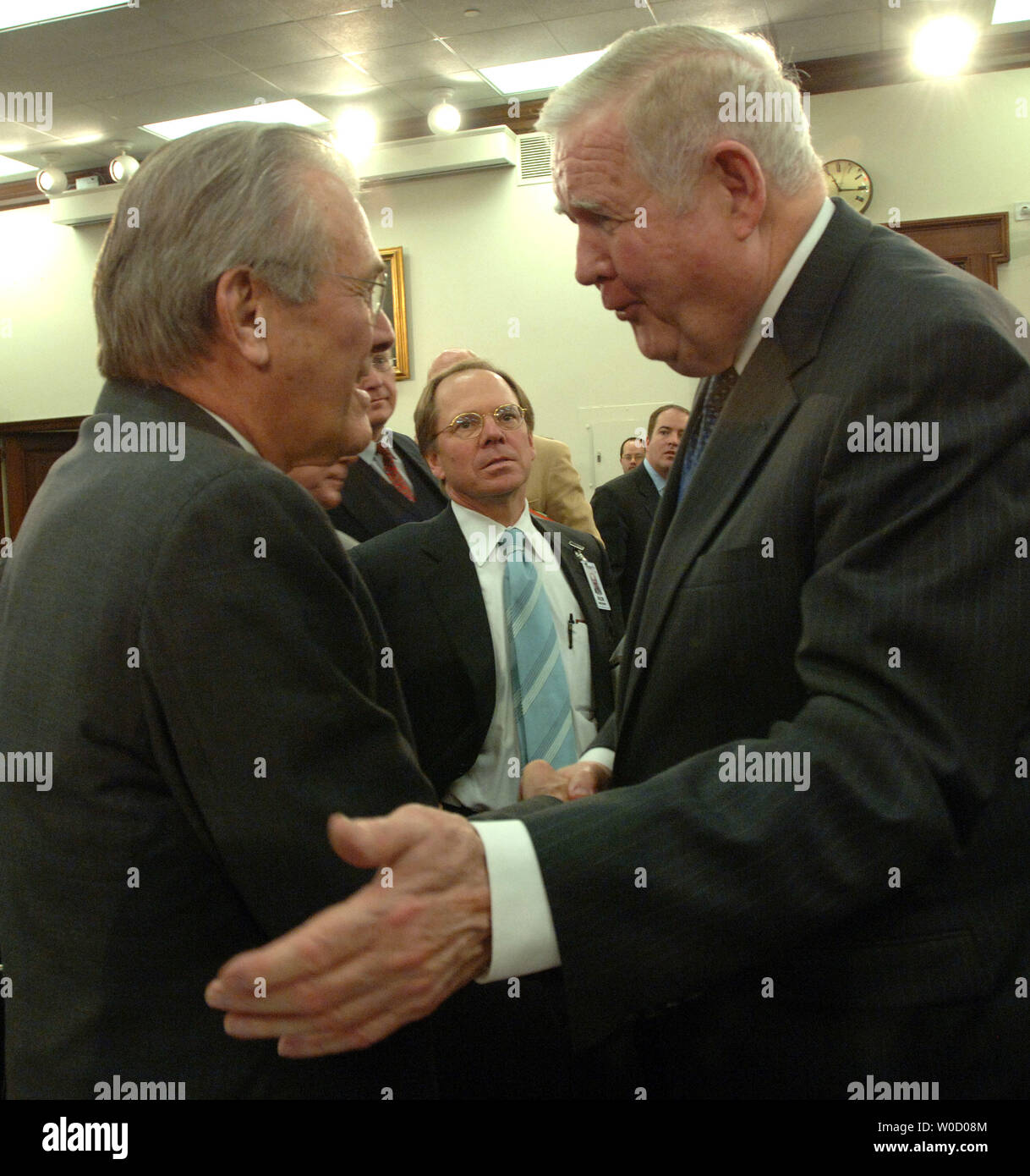 Defense Secretary Donald Rumsfeld (L) speaks with Rep. John Murtha, R ...