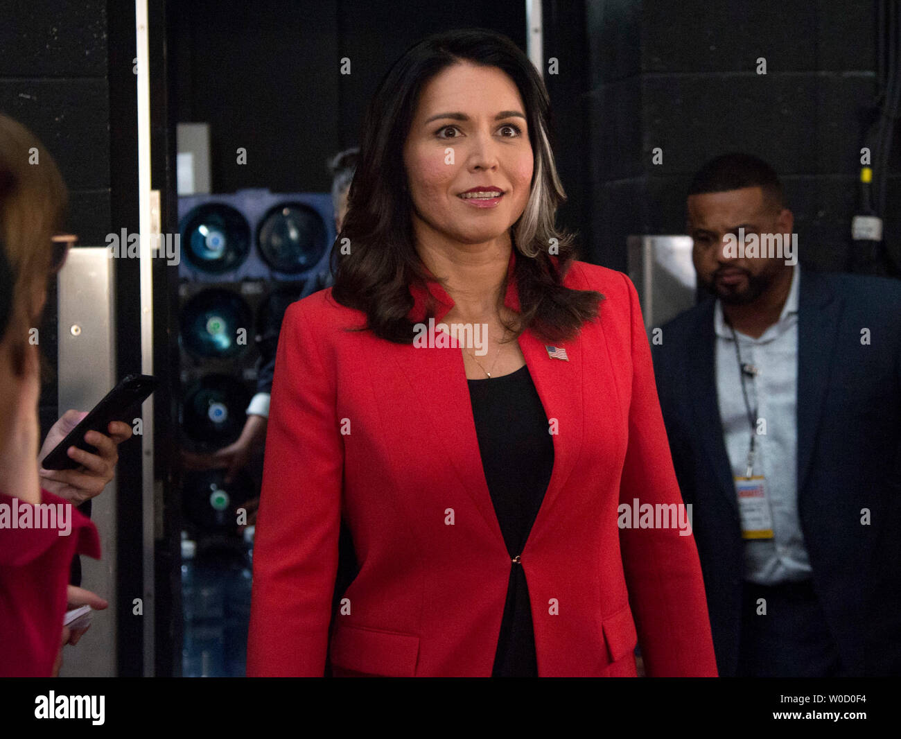 Miami, Florida, USA. 26th June, 2019. TULSI GABBARD enters the press ...