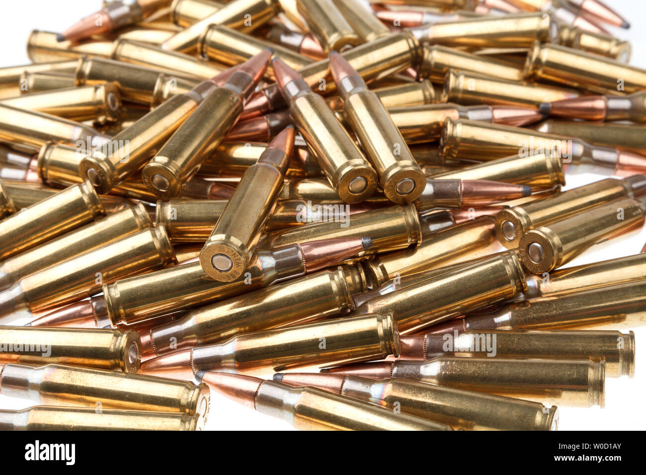 cartridges for 308 caliber rifle on a white background. a bunch of ammo ...