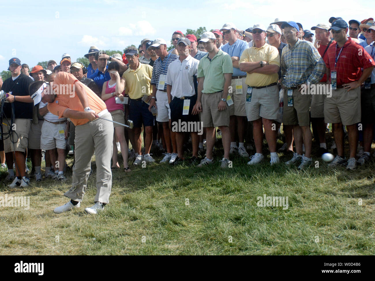 Kenneth Ferrie hits from the heavy rough, on the fourteenth hole ...