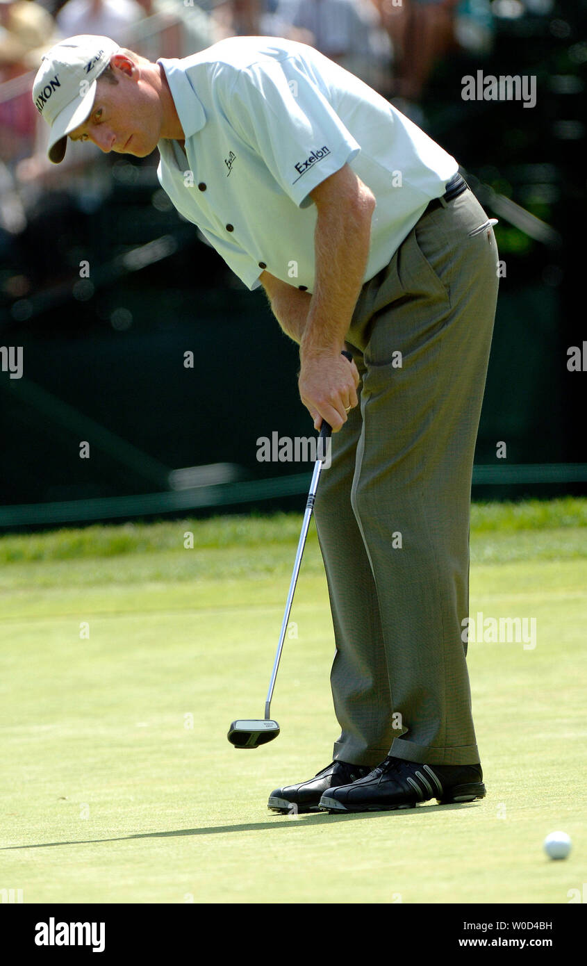 Jim Furyk attemps to sink a putt on the fourteenth hole, during the ...
