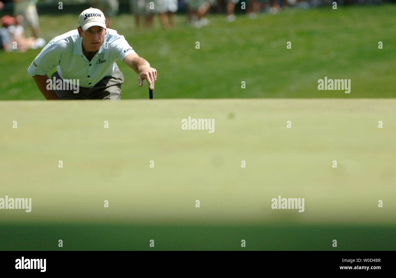 Jim Furyk lines up a putt on the fourteenth green, during the second ...