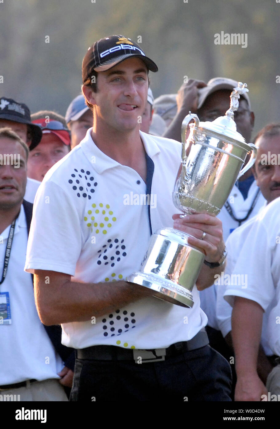 Geoff Ogilvy walks in hand with the US Open Championship Cup after ...