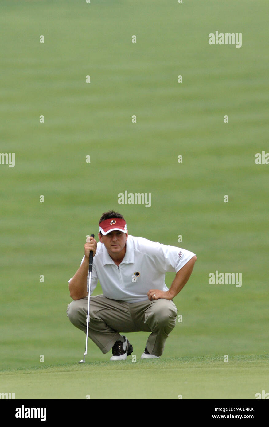 Ben Curtis lines up a putt on the second green, during the second round ...