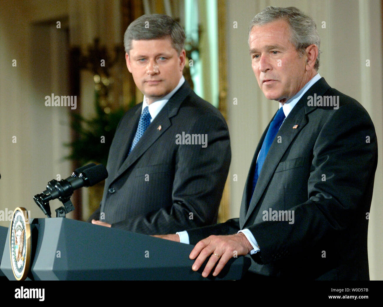 President George W. Bush (R) speaks along side Canadian Prime Minister ...