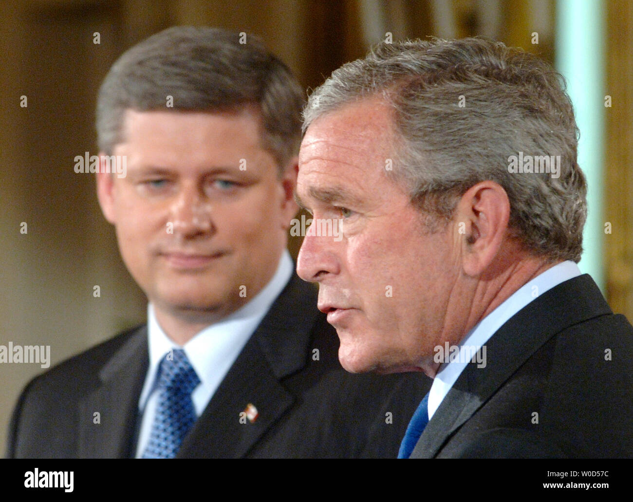 President George W. Bush (R) speaks along side Canadian Prime Minister ...