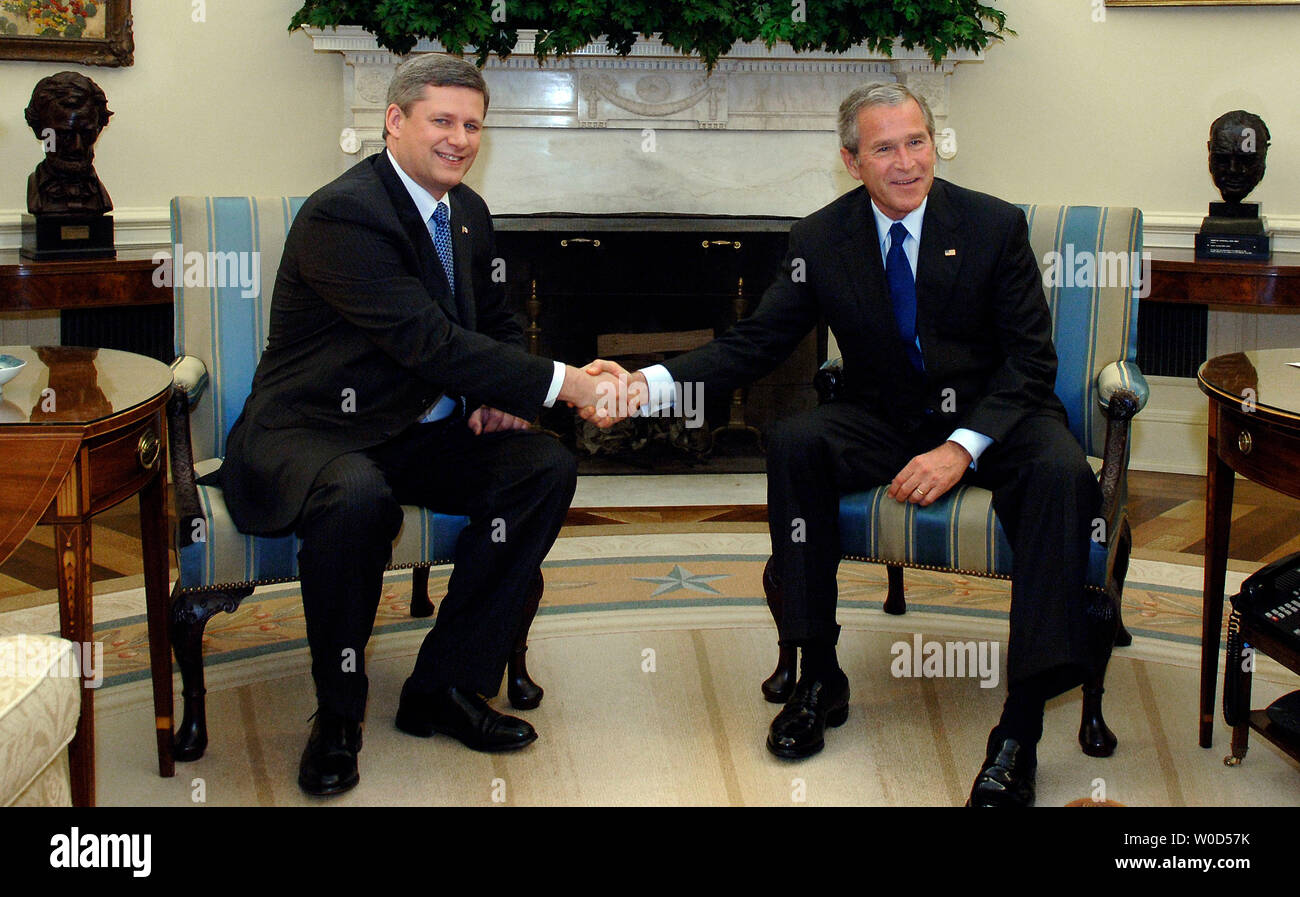 President George W. Bush (R) meets with Canadian Prime Minister Stephen ...