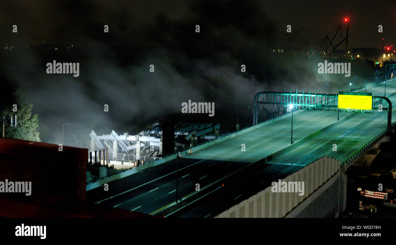 Smoke rises from a section of the original Woodrow Wilson Bridge which ...