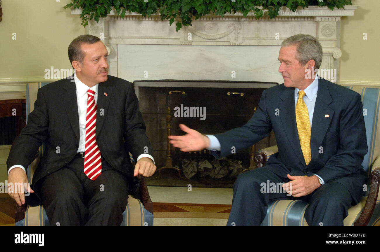U.S. President George W. Bush reaches out to shake hands with Turkish ...