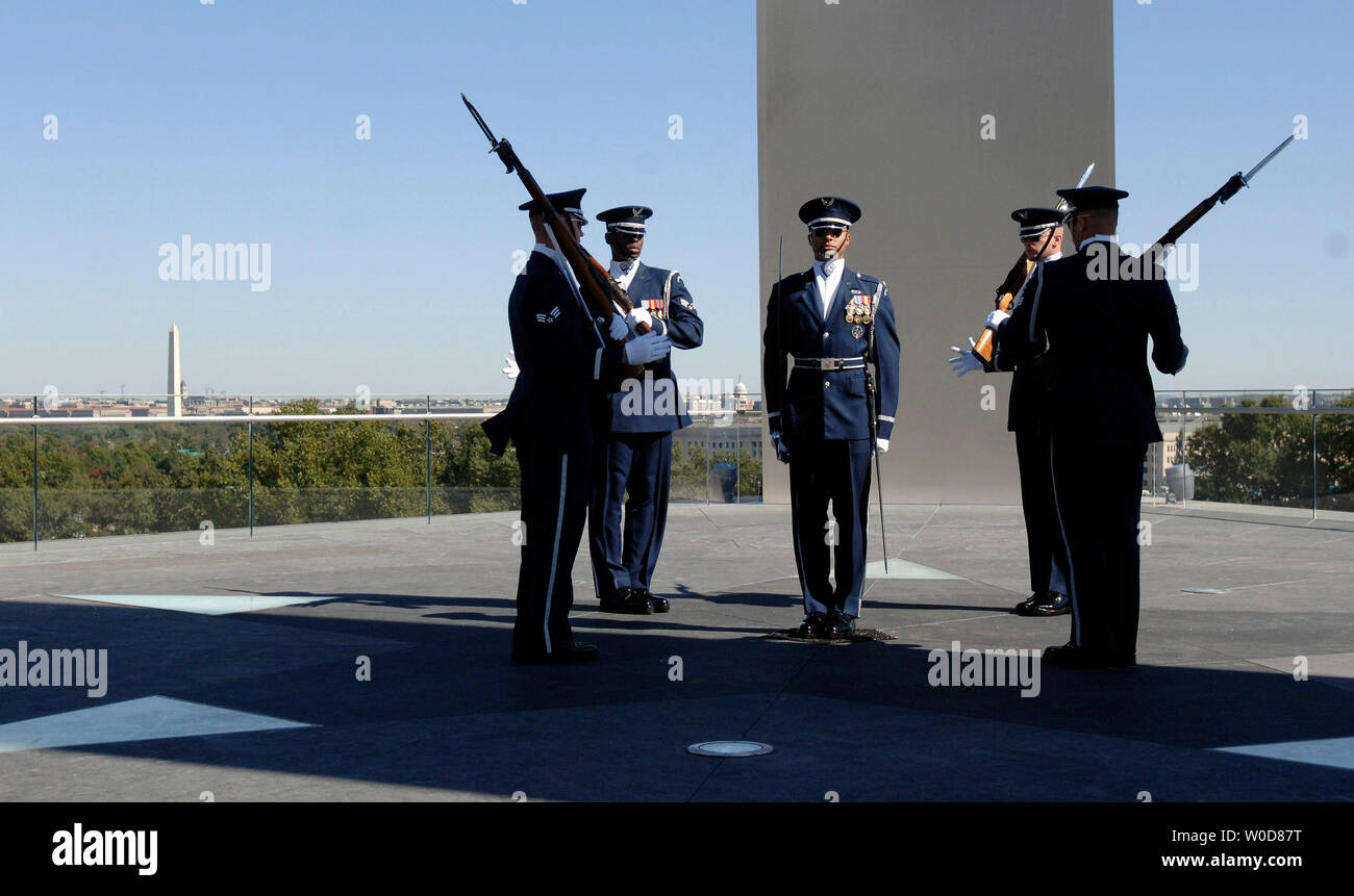 Members of the United States Air Force Honor Guard perform underneath ...