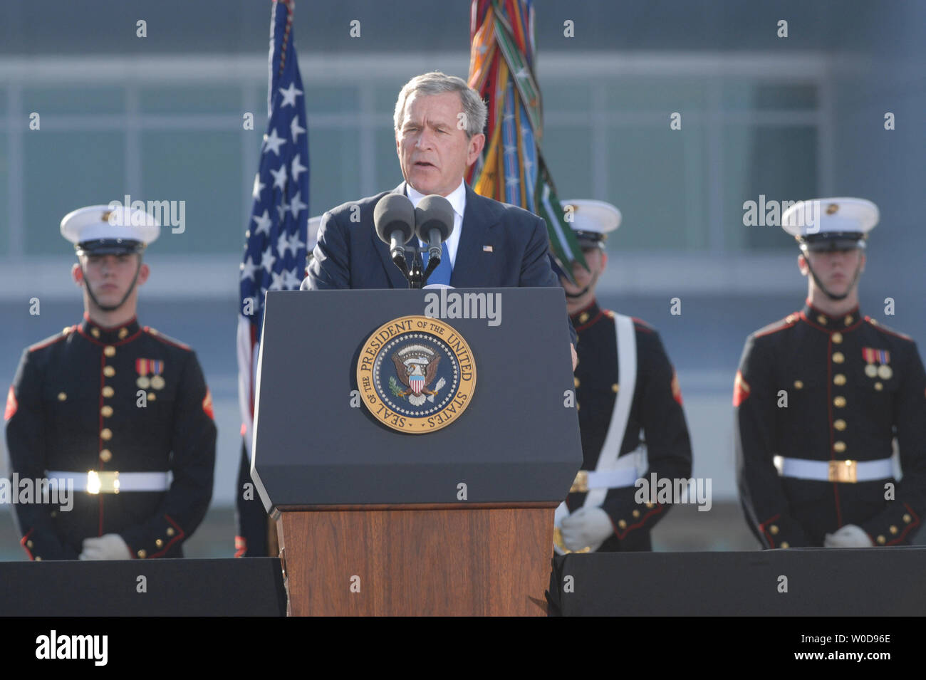 U.S. President Geogre W. Bush, flanked by Marine Corps officers, speaks ...