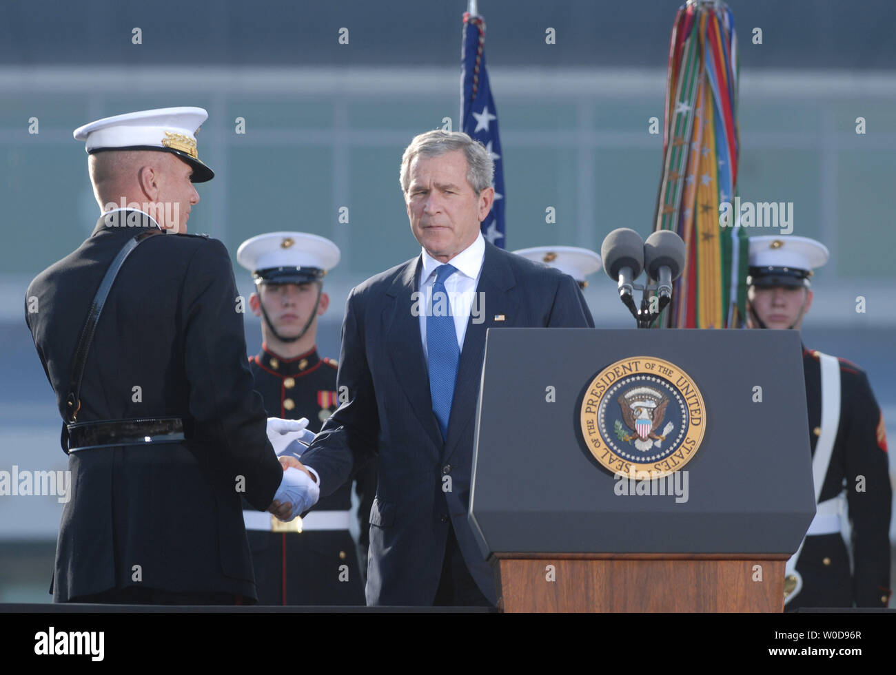 U.S. President Geogre W. Bush, shakes hands with Commandant of the ...