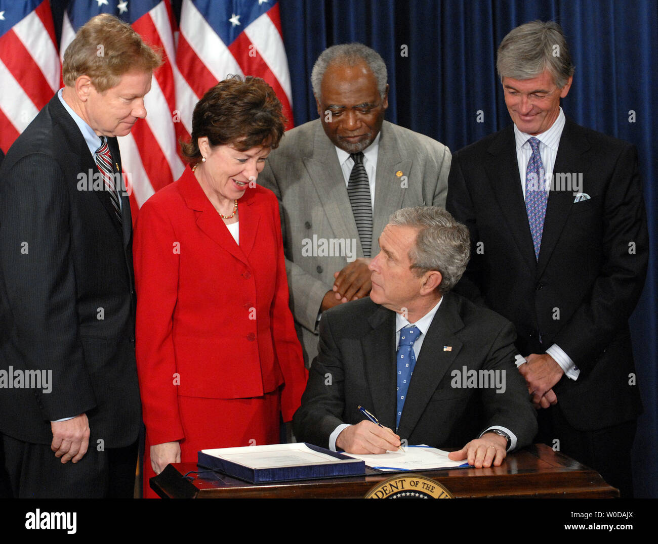 U.S. President George W. Bush signs the Postal Accountability and ...