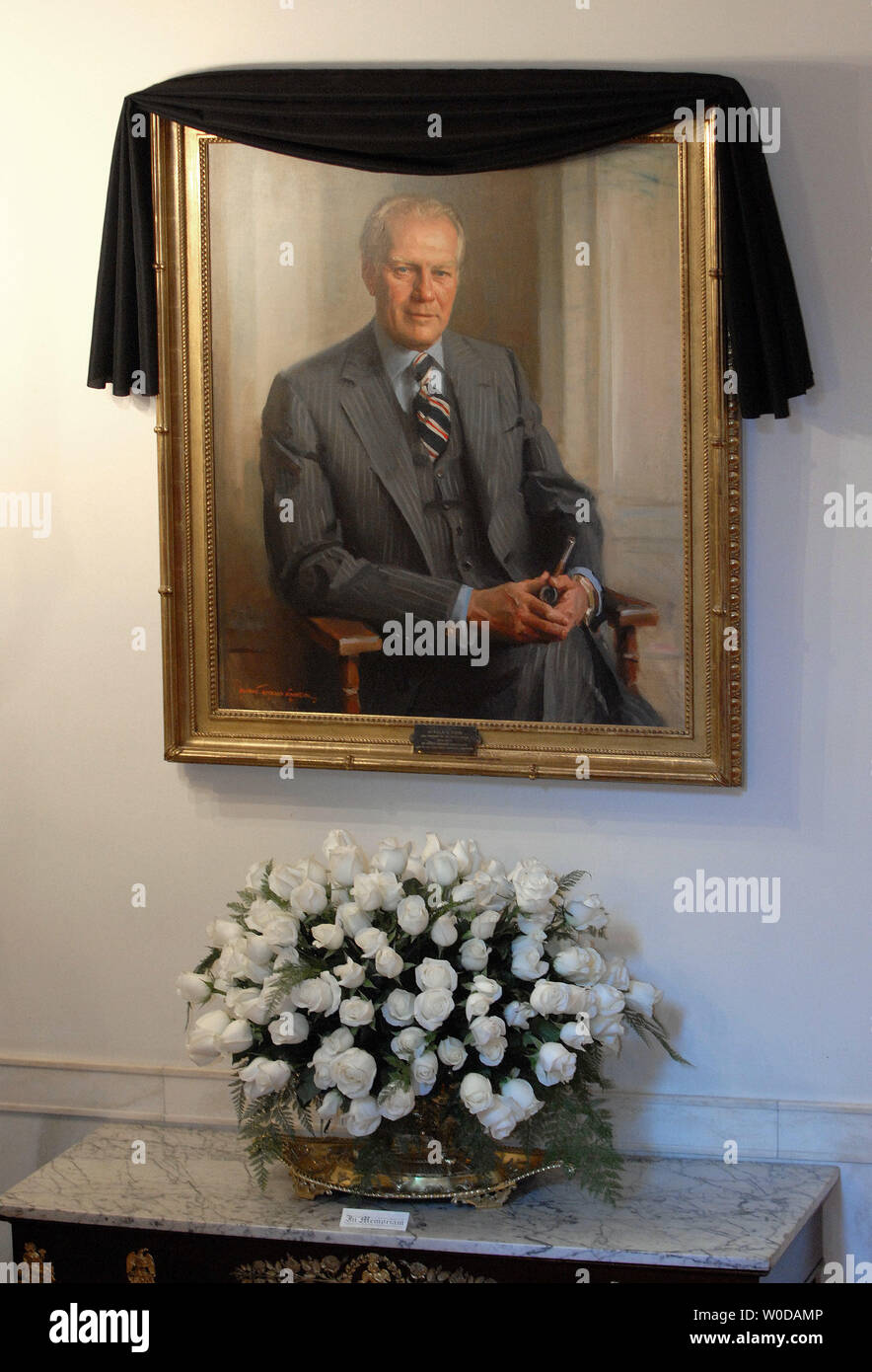 Former President Gerald R. Ford's portrait is draped in black and ...