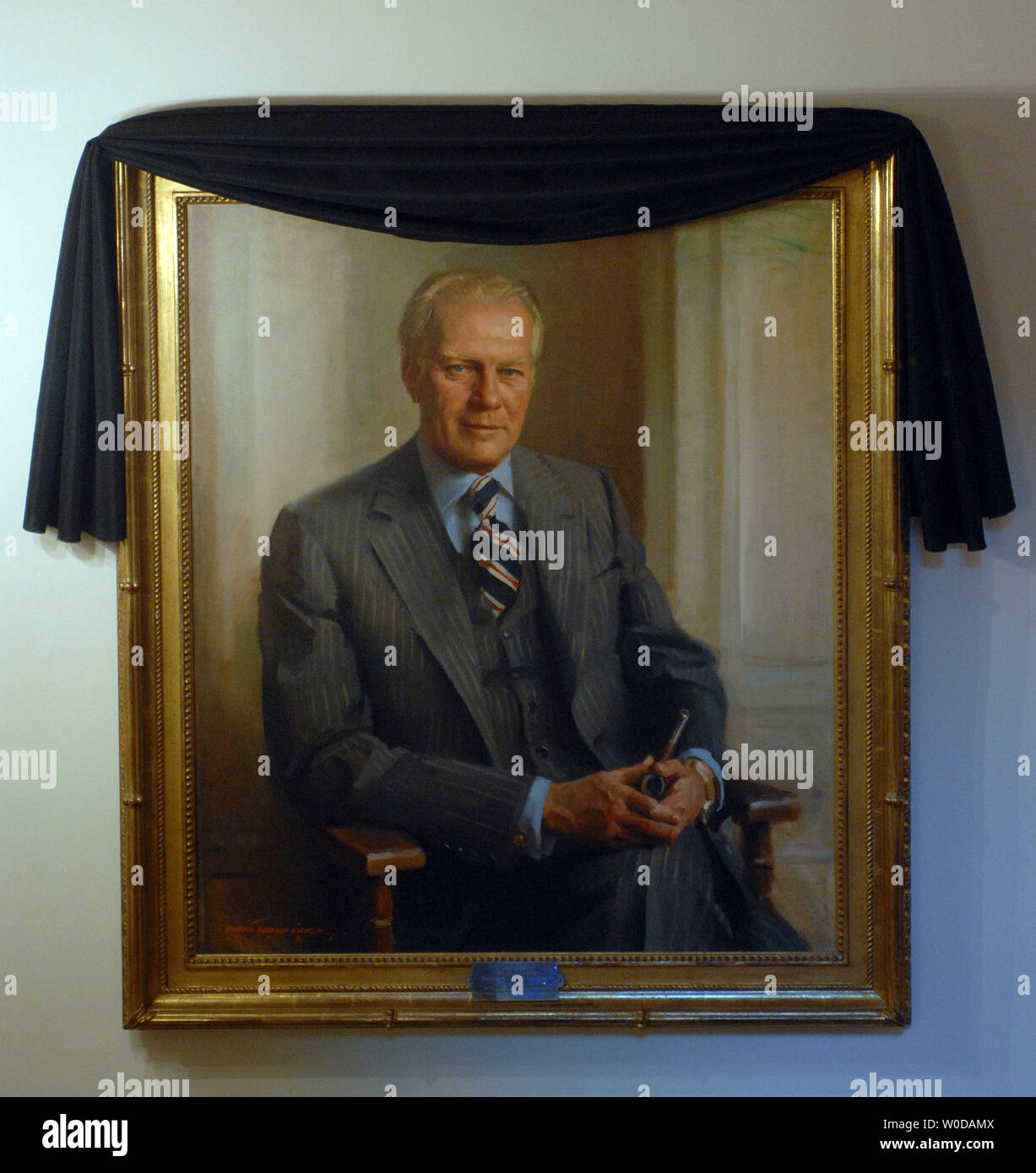 Former President Gerald R. Ford's portrait is draped in black and ...