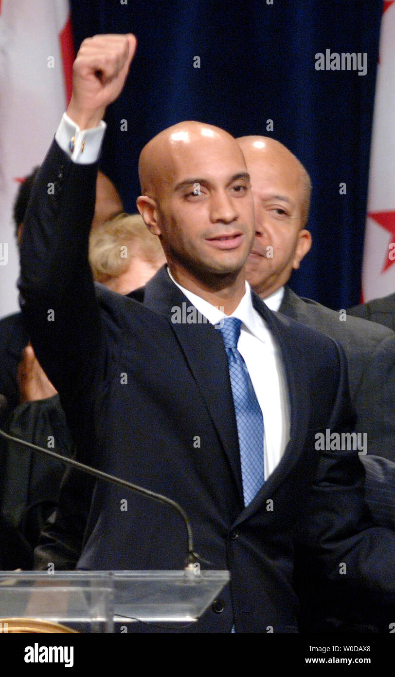 D.C. Mayor Adrian Fenty holds up his fist after being sworn into office ...