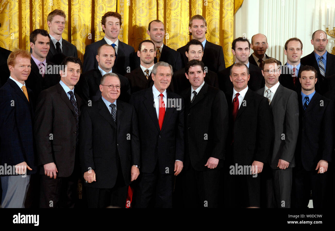 U.S. President George W. Bush poses with the 2006 NHL Stanley Cup ...
