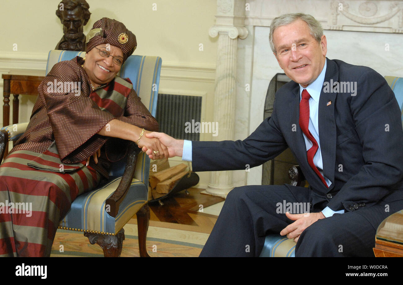U.S. President George W. Bush shakes hands with Liberian President ...