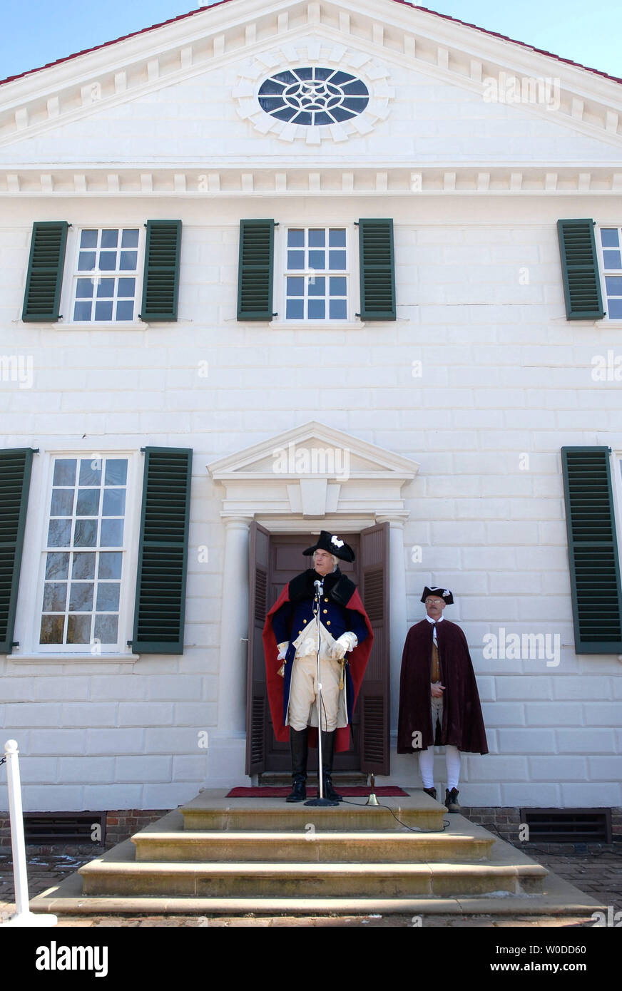 Dean Malissa, playing the role of President George Washington, greets ...