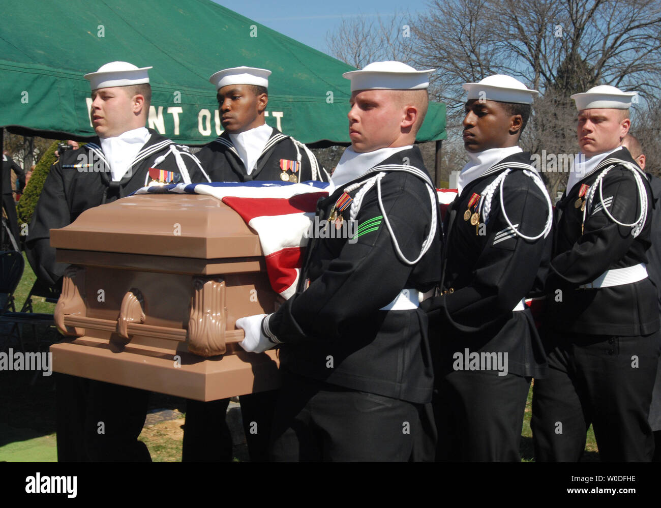 The Navy Honor Guard carries the casket of Charlotte Winters, the last ...